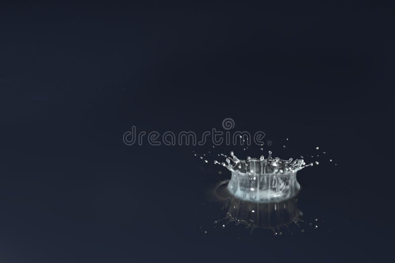 White Droplets Falling into the Blue Stock Photo - Image of droplets ...