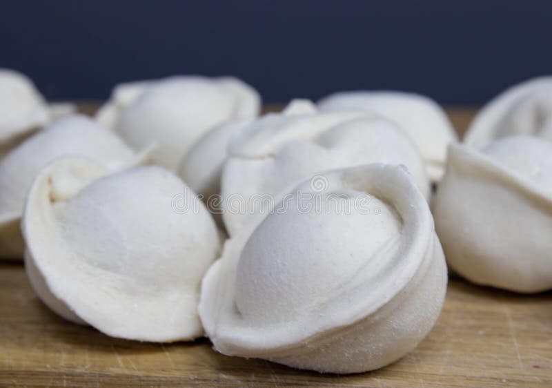White Dumplings on Kitchen Board, Space for Text. Frozen Dumplings ...