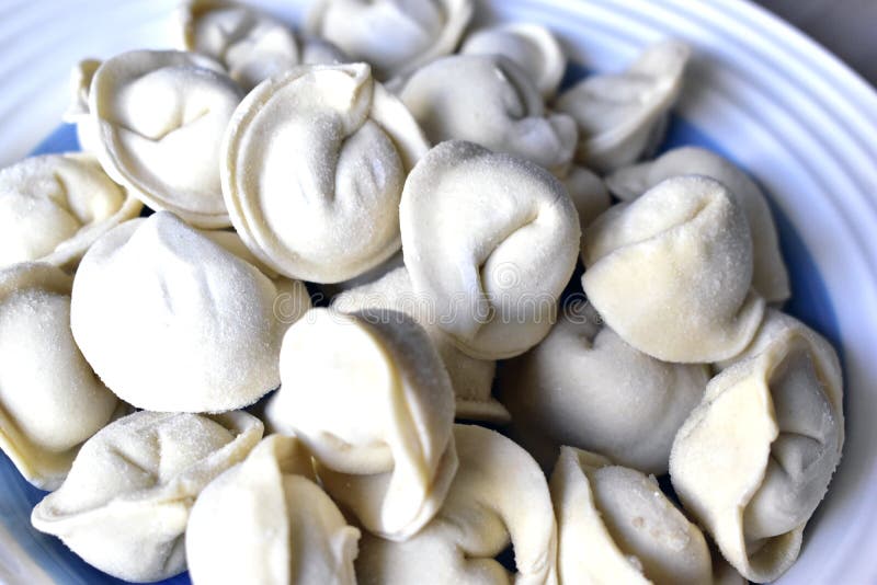 White Dumplings with Meat on a Blue Plate Stock Photo - Image of ...