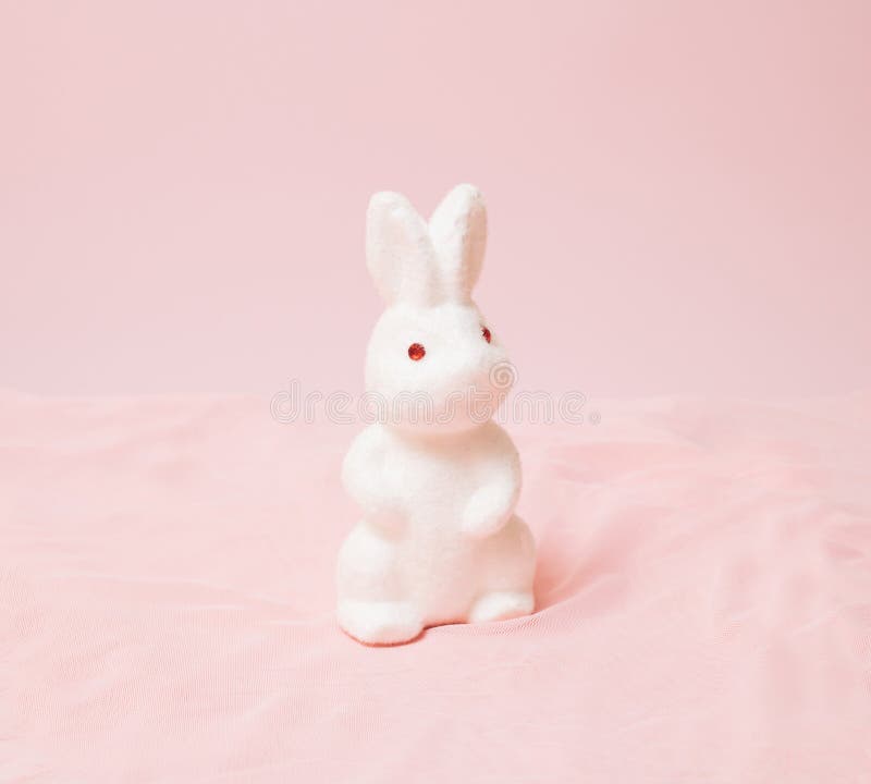 White Easter Bunny on a Pink Background. Minimal Design Stock Photo ...