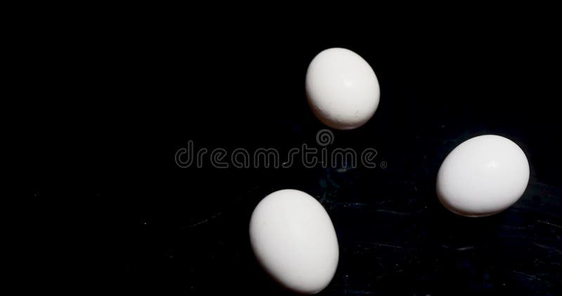 White Easter Chicken Eggs Spin on a Black Table. Perfect for Easter ...