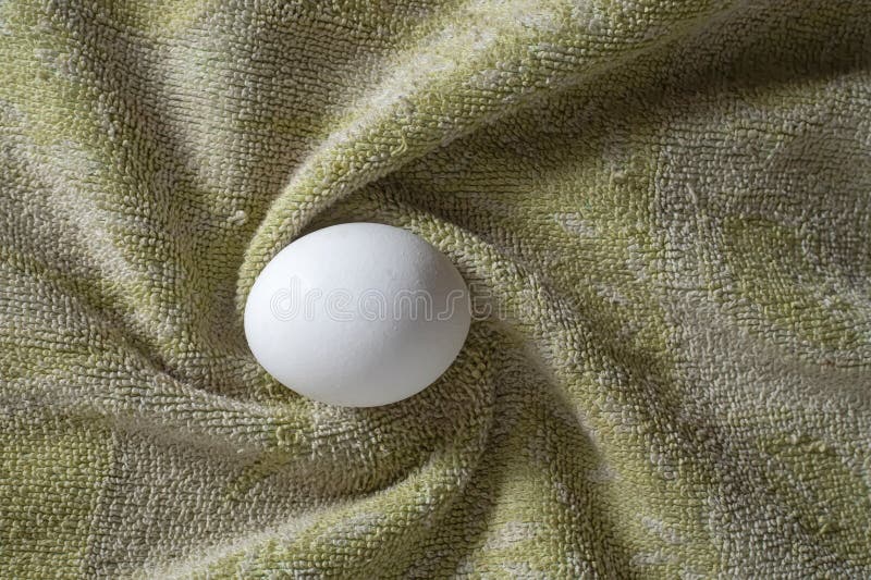 White Egg on Green Cloth with Natural Light, Top View Stock Photo ...