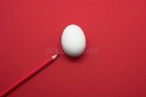 White Egg on Red Background with Red Pen Stock Photo - Image of ...