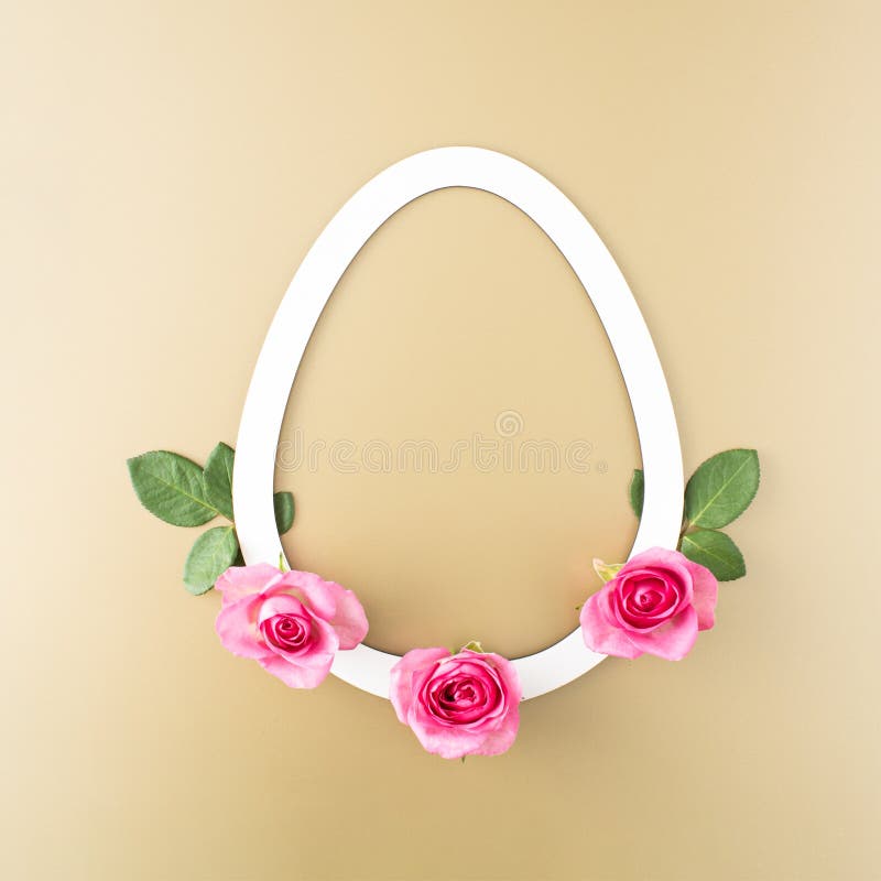 White Egg Shape Frame Decorated with Pink Roses on Golden Background ...