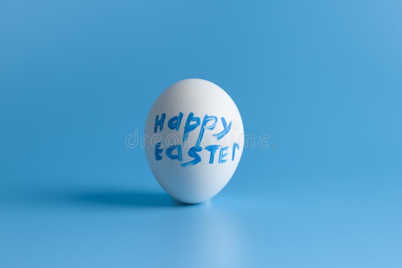 White Egg with Text on a Blue Background Stock Photo - Image of dinner ...