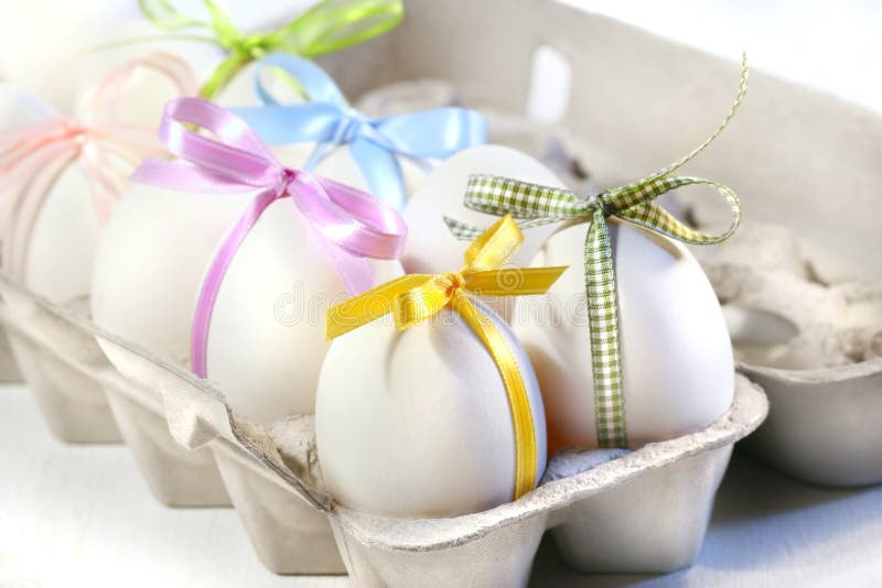 White Eggs with Colored Ribbons Stock Photo - Image of blue, color: 4158428
