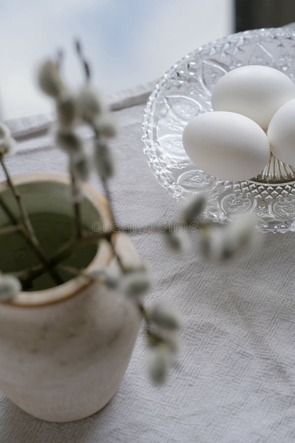 White Eggs on a Crystal Plate. Easter Table Decoration Stock Image ...