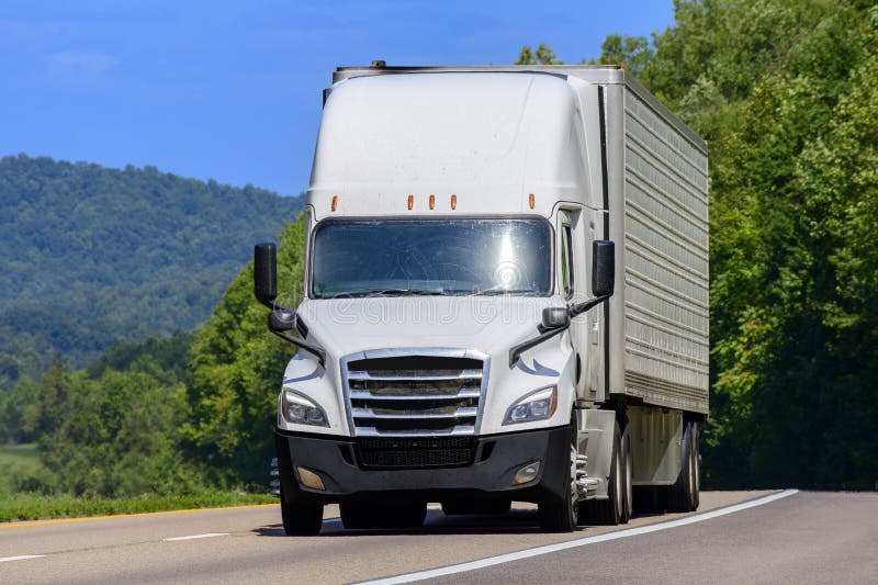 White Eighteen-Wheeler on Interstate Highway with Copy Space Stock ...