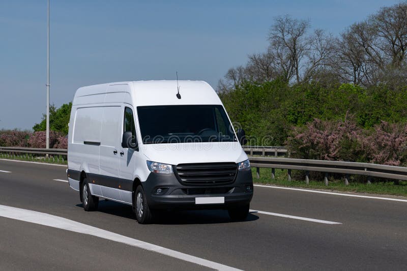 White Electric Delivery Van on the Road Stock Image - Image of ...