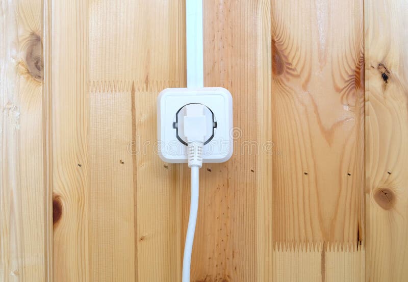 White Electric Plug in Socket on Wooden Wall with Vertical Planks Stock ...