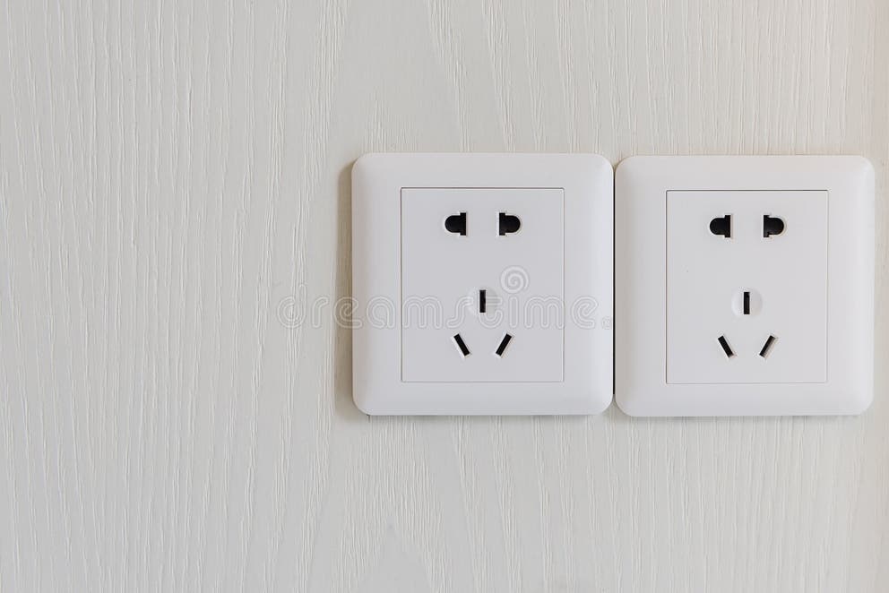White Electric Plugs or Outlet on Wall Stock Image - Image of electric ...