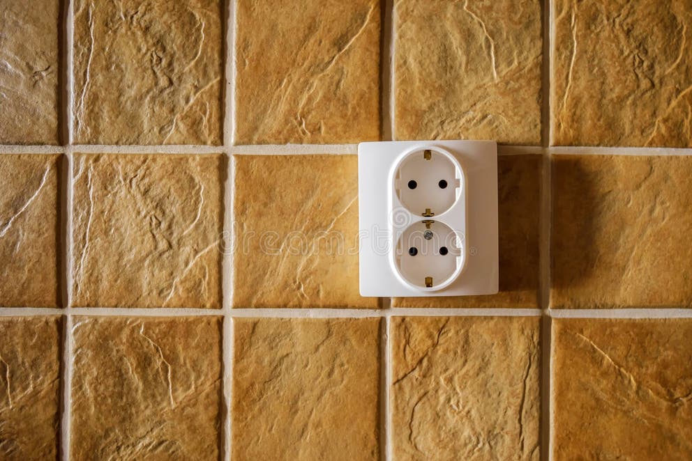 White Electric Socket on Kitchen Wall with Ceramic Tiles Stock Photo ...