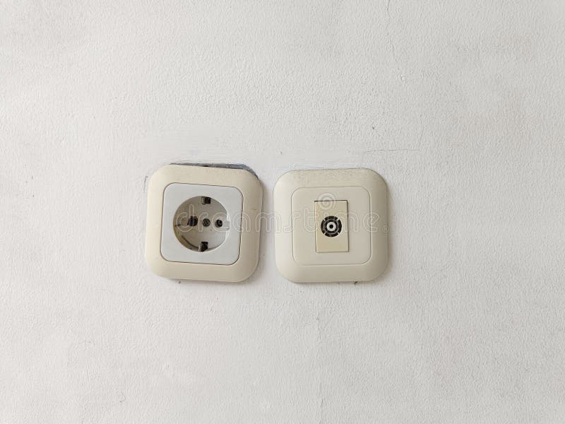 White Electric Socket on a White Wall. Cable Plug Hole for Electricity ...