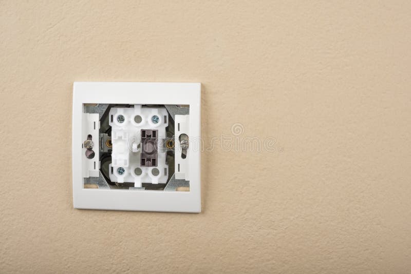White Electric Switch with on a Wall and without Cover Stock Image ...