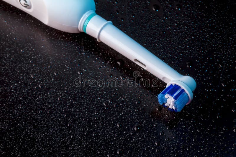 White Electric Toothbrush on Black Stock Photo - Image of health, macro ...