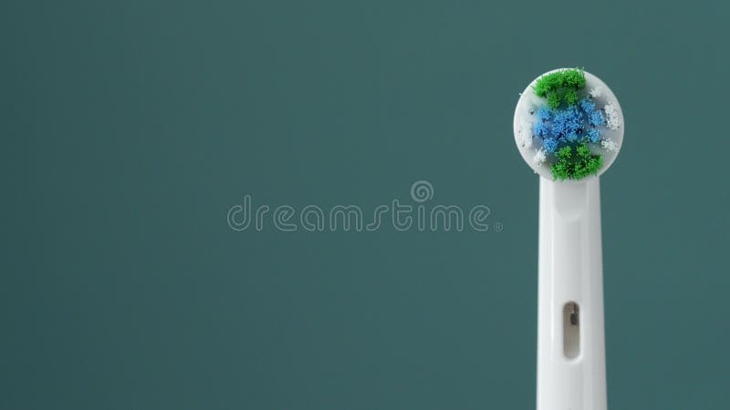 White Electric Toothbrush on a Blue Background. Zoom Effect. Stock ...