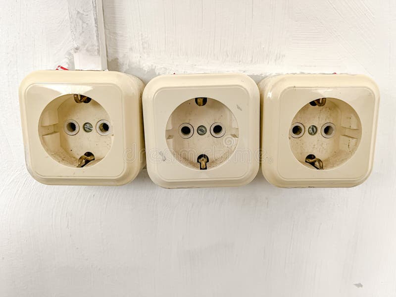 A White Electrical Outlet on the Wall in the Room. an Electric Plug ...