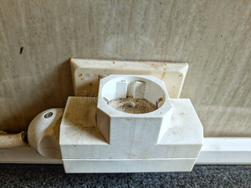 A White Electrical Outlet on the Wall in the Room. an Electric Plug ...