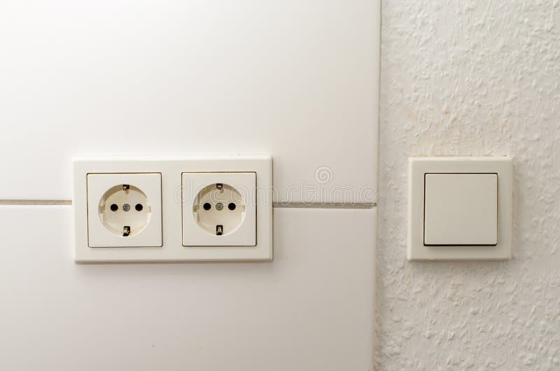 White Electrical Outlets and Light Switch on White Wall Stock Photo ...