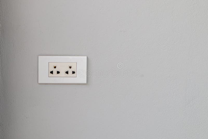 The White Electrical Plug Socket on a Gray Concrete Wall. Stock Image ...