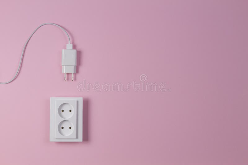 White Electrical Power Socket and Power Plug on Light Pink Background ...
