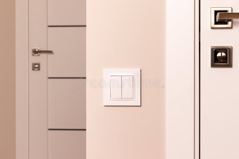 White Electrical Switch on Beige Wall Stock Image - Image of design ...