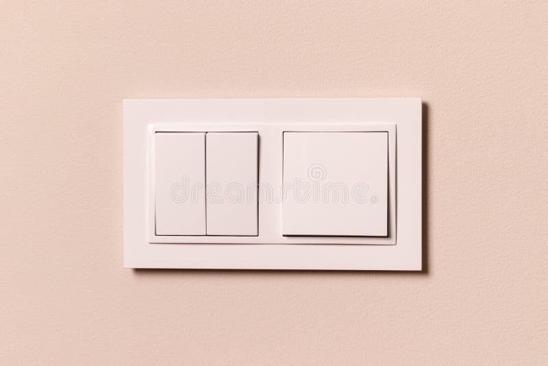 White Electrical Switches on Beige Wall Stock Photo - Image of ...