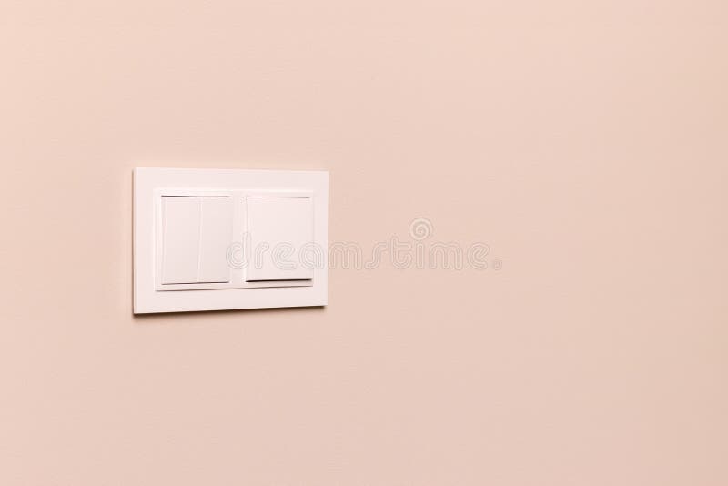 White Electrical Switches on Beige Wall Stock Image - Image of building ...