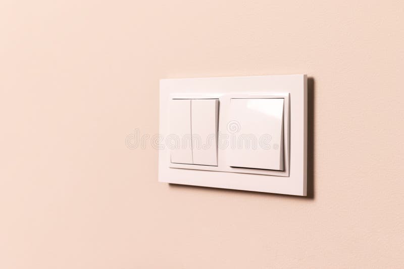 White Electrical Switches on Beige Wall Stock Photo - Image of ...