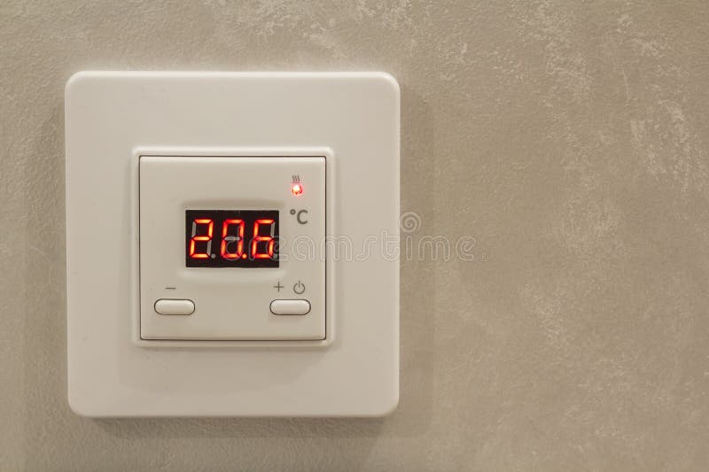 White Electronic Programmable Digital Thermostat on Light Wall Copy ...