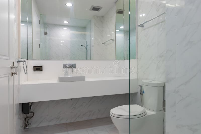 White Elegant Bathroom with Clean Marble Tile Walls Stock Photo - Image ...
