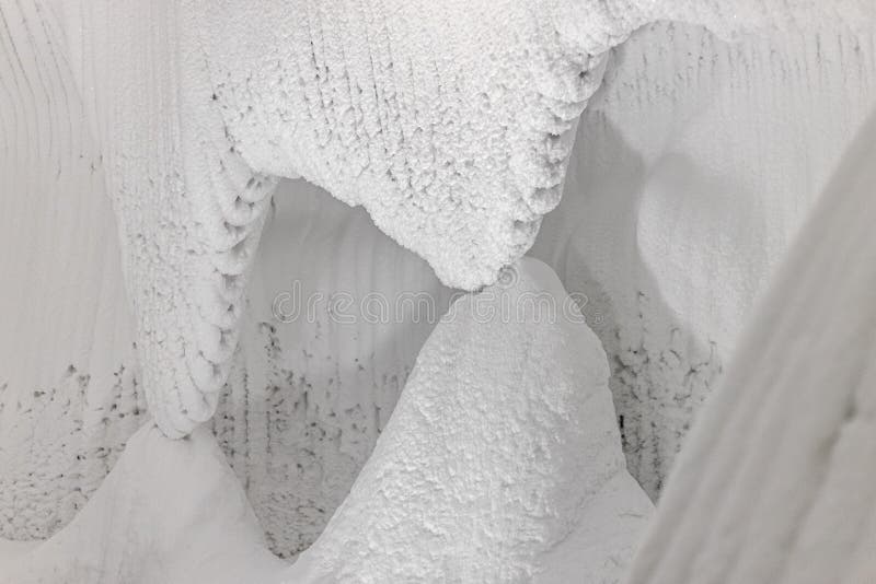 White Embossed Walls of Ice and Snow in a Cave. Abstract Textured ...