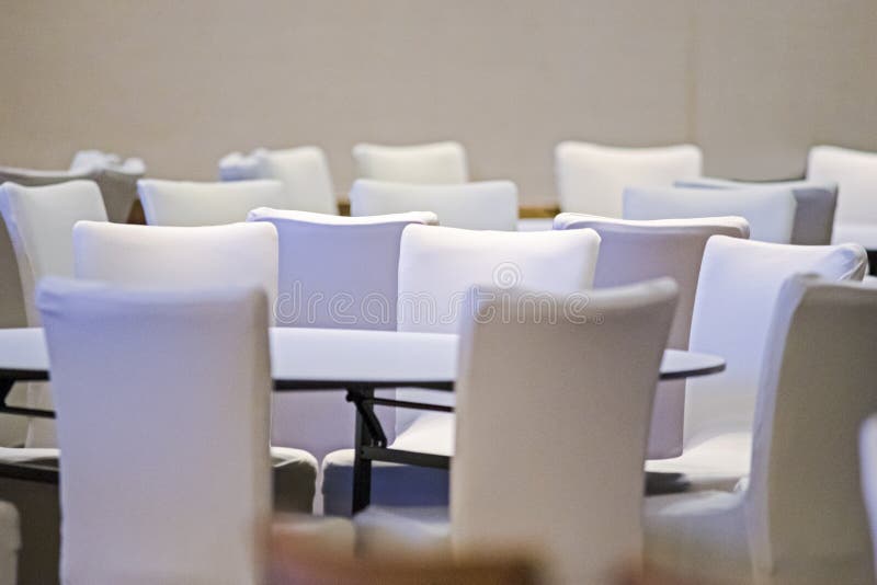 White Empty Chairs Standing Around Tables in the Empty Room Stock Image ...