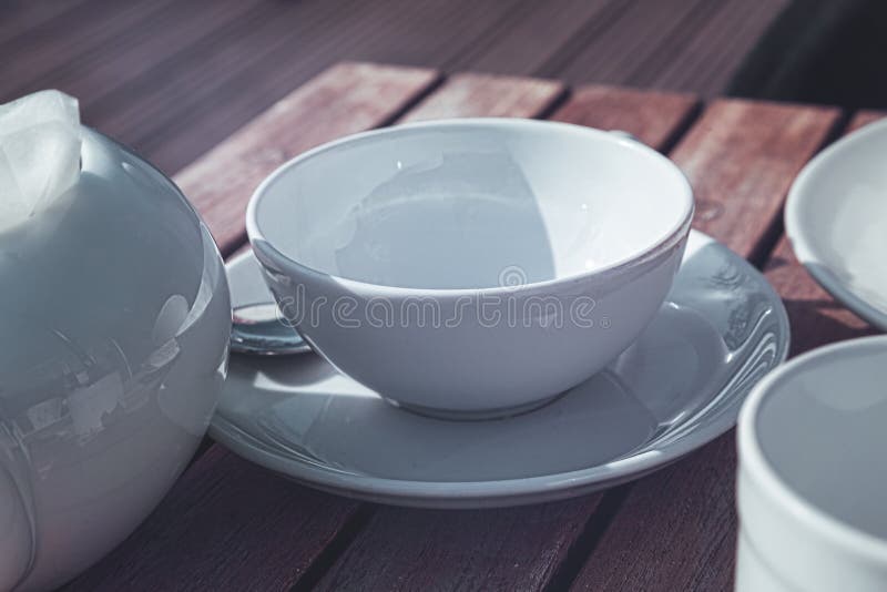 White Empty Dishes on a Table Stock Photo - Image of spoon, drink ...