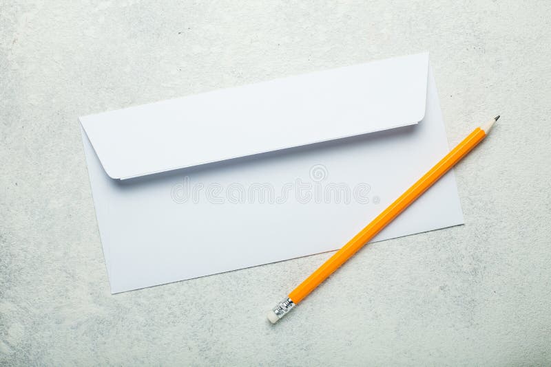 White Empty Envelope on the Background of a Light Vintage Table with a ...