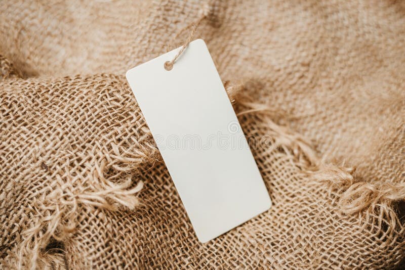 White Empty Label Tag on Vintage Burlap Background Stock Photo - Image ...