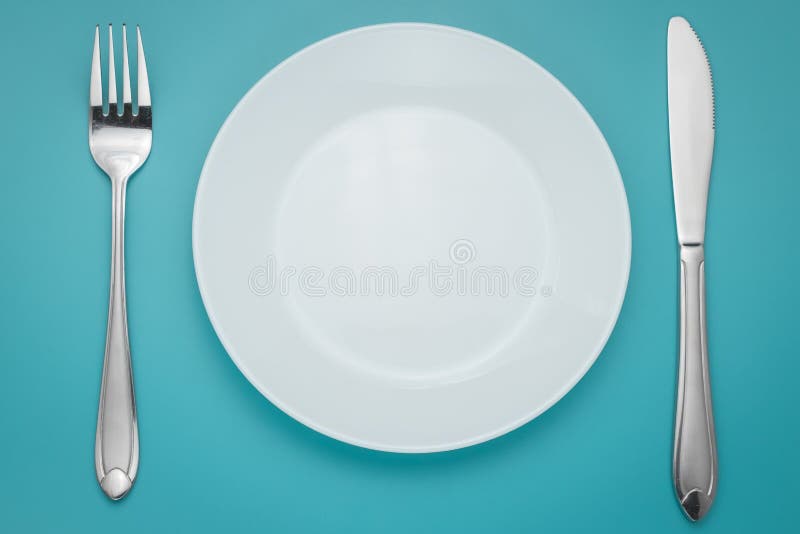 White Empty Plate with Fork and Knife on Blue Background. Turquoise ...