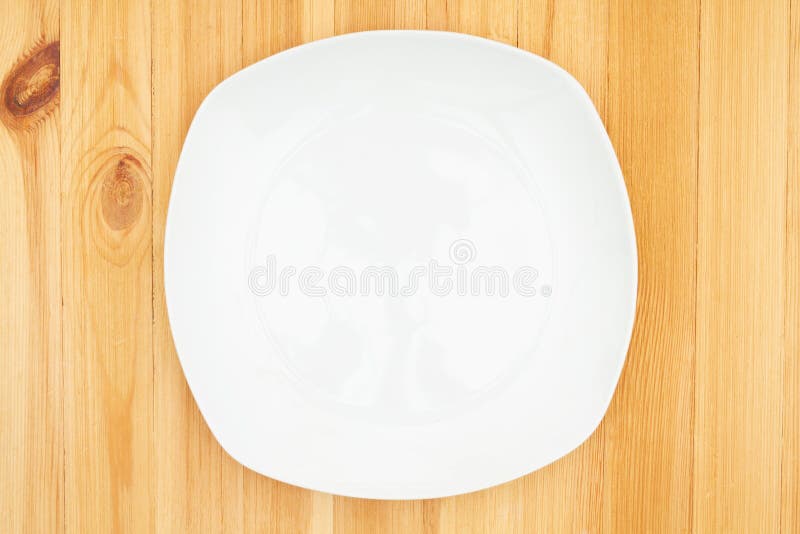 White Empty Plate on a Wood Table Stock Photo - Image of plate ...
