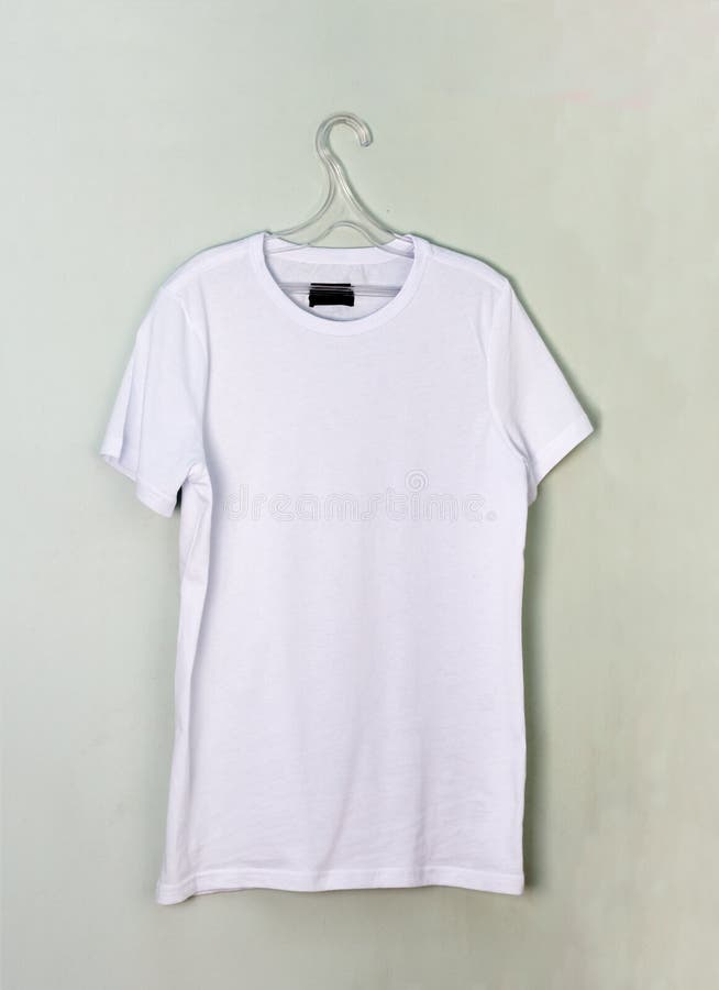 White Empty T-shirt on a Light Painted Wall Stock Photo - Image of ...