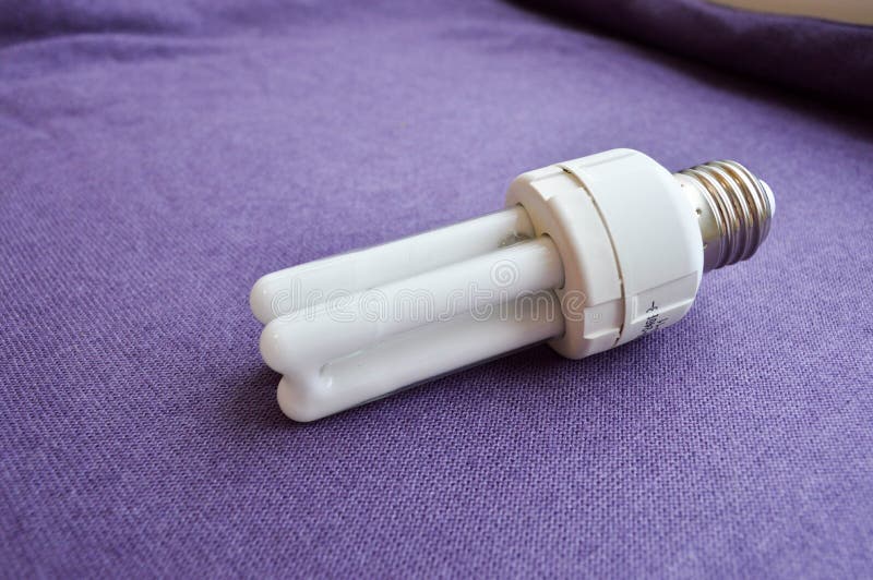 White Energy-saving Fluorescent Light Bulb with Four Tubes, with a ... White Energy-saving Fluorescent Light Bulb with Four Tubes, with a ...