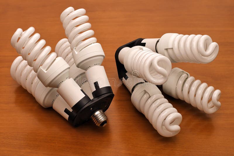 White Energy Saving Light Bulb on a Wooden Table Stock Photo - Image of ...