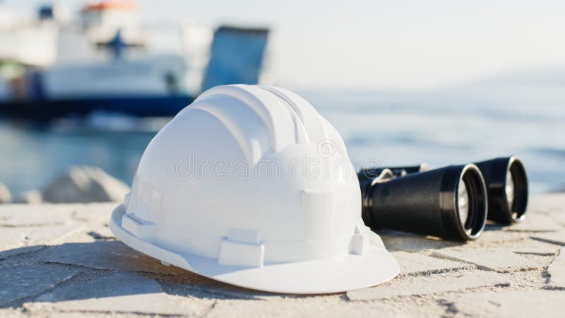 White Engineer Helmet and Binoculars in a Naval Port Stock Image ...