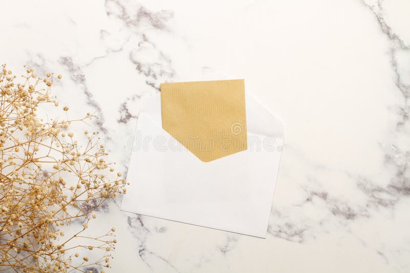 A White Envelope with a Brown Paper Inside on a Marble Kitchen Counter ...