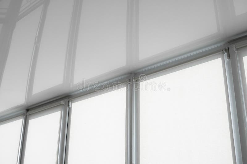 White Fabric Roller Blinds on the Plastic Window on a Balcony in the ...