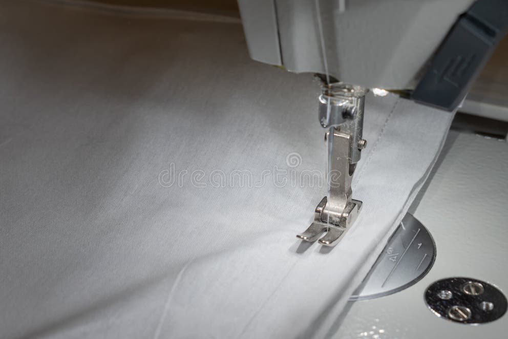 The White Fabric is Sewn on Ar Automatic Sewing Machine Stock Image ...