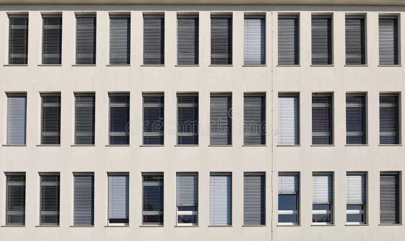 White Facade of Modern Office Building with Long Vertical PVC Windows ...