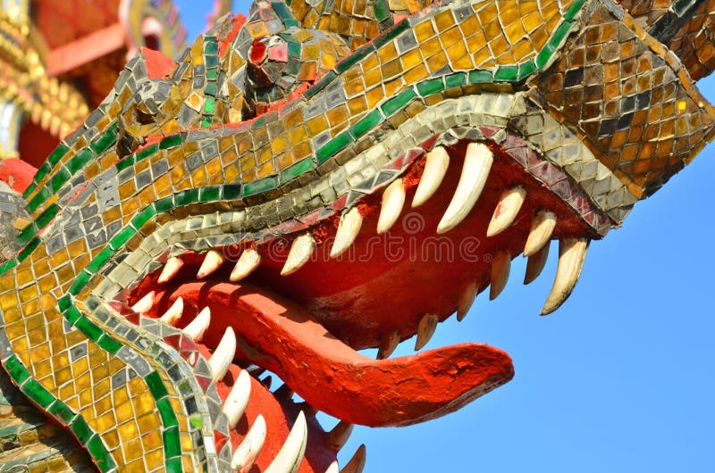 White Fangs and Colored Mirror Bits of Naga Sculpture Stock Photo ...