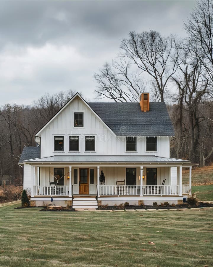 A White Farmhouse with a Porch and a Large Front Porch Stock Photo ...