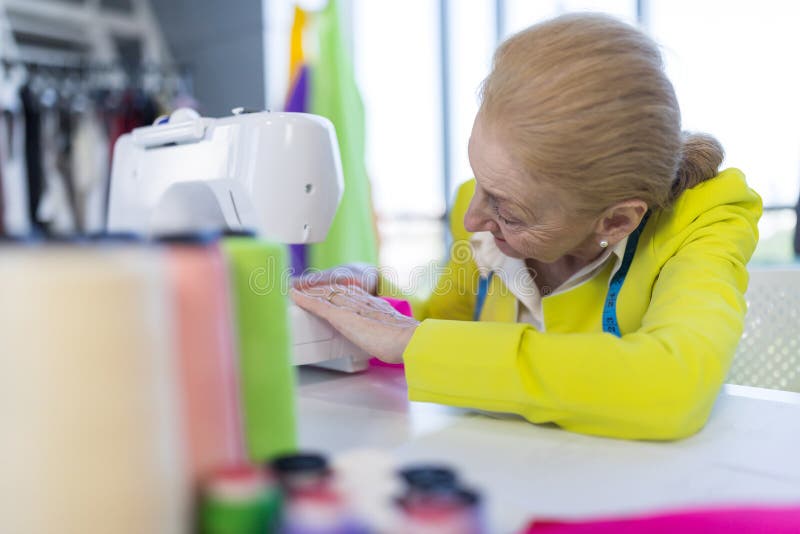 Female Designer Sewing Clothes with Sewing Machine Stock Photo - Image ...