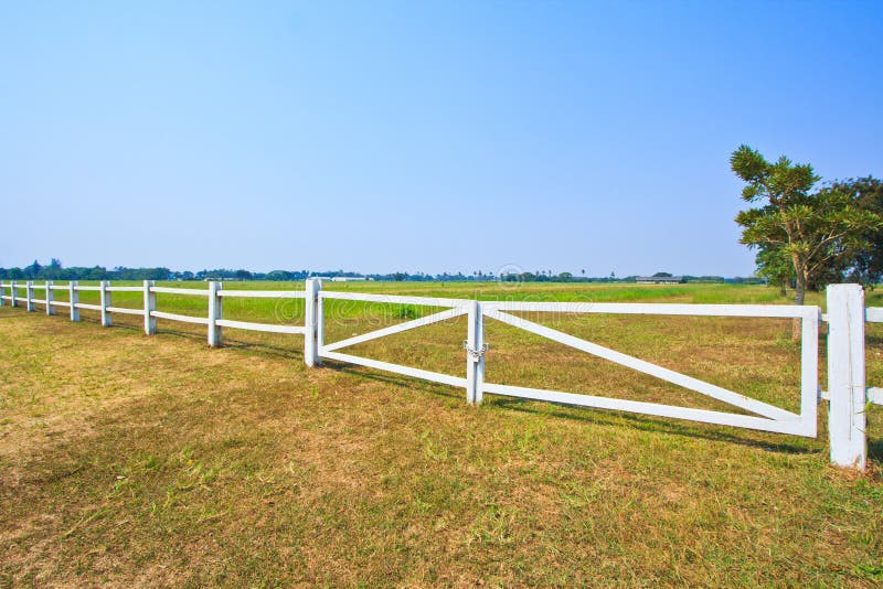 White fence in the field stock photo. Image of freedom - 32431146
